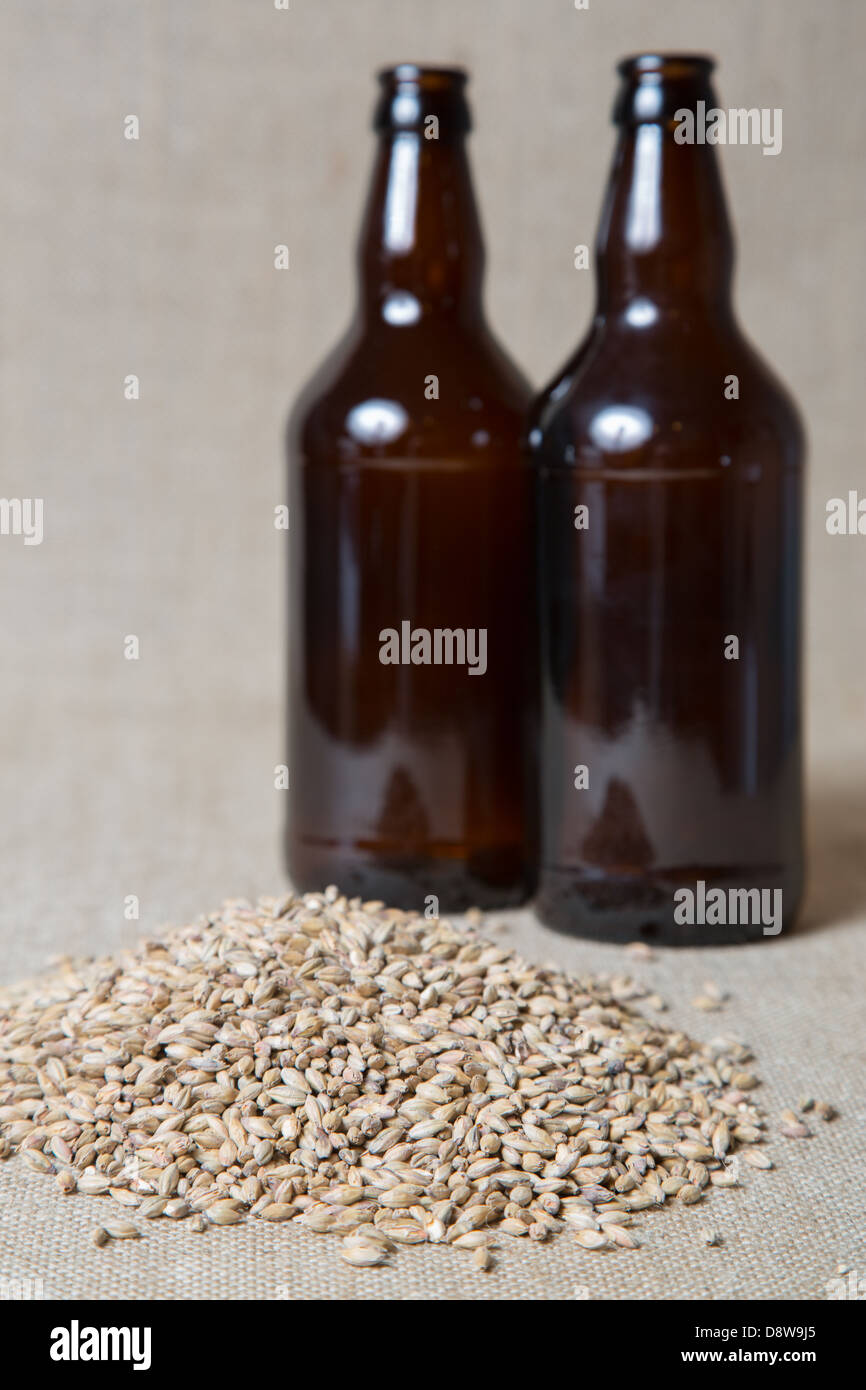 Amber malt and beer bottles Stock Photo - Alamy