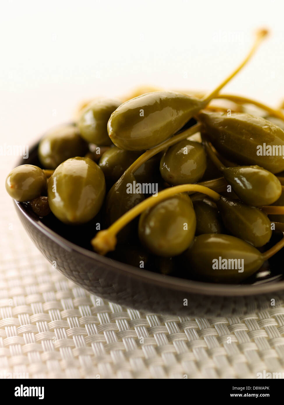 Small dish of capers Stock Photo - Alamy