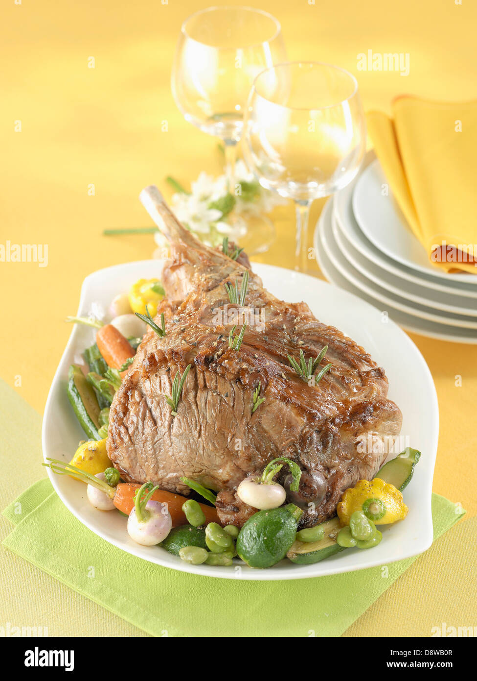 Leg of lamb with spring vegetables Stock Photo - Alamy