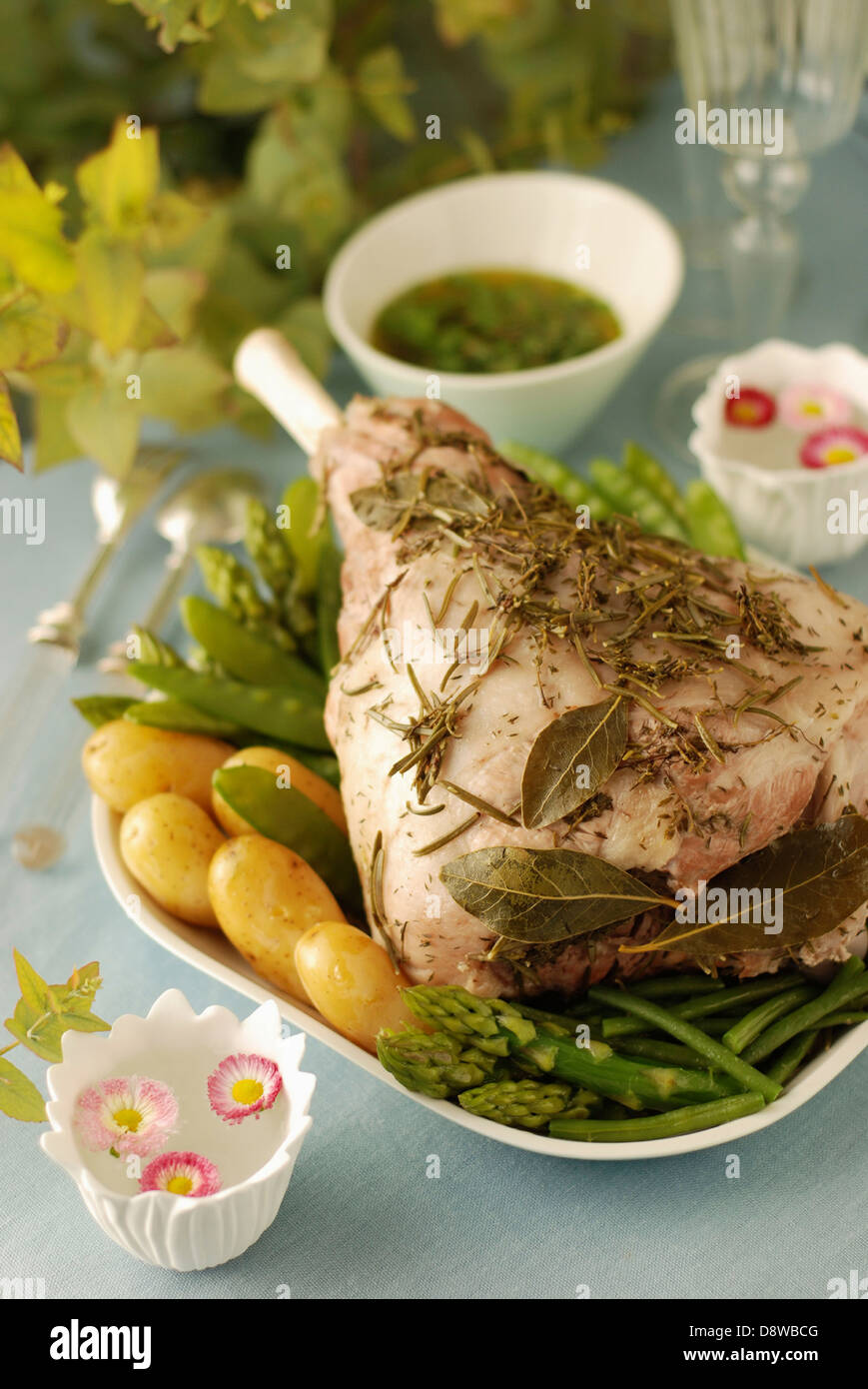 Shoulder of lamb cooked with herbs in a cloth Stock Photo - Alamy