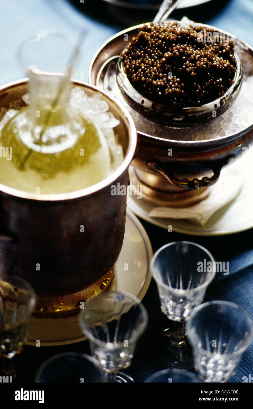 Vodka in an ice bucket and caviar Stock Photo - Alamy