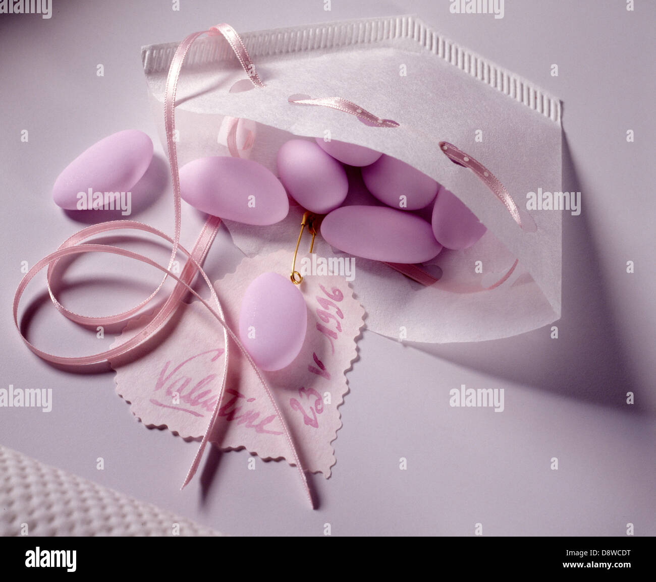 Bag of pink sugared almonds for the birth of a baby girl Stock Photo ...