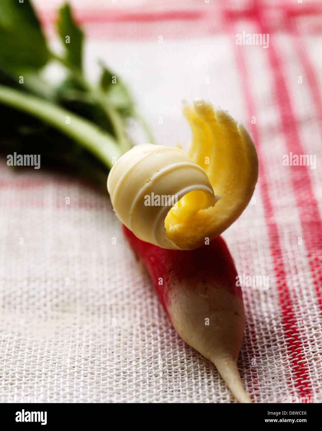 Curl of butter on a radish Stock Photo - Alamy