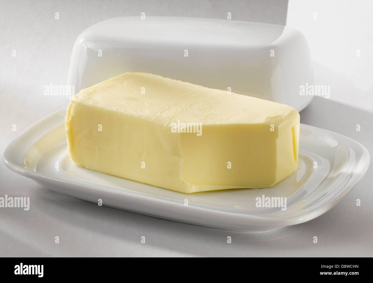 Slab of butter in a china butter dish Stock Photo - Alamy