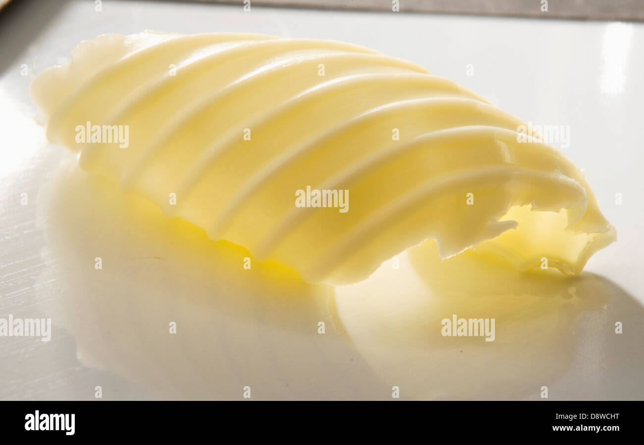 Curl of butter Stock Photo - Alamy