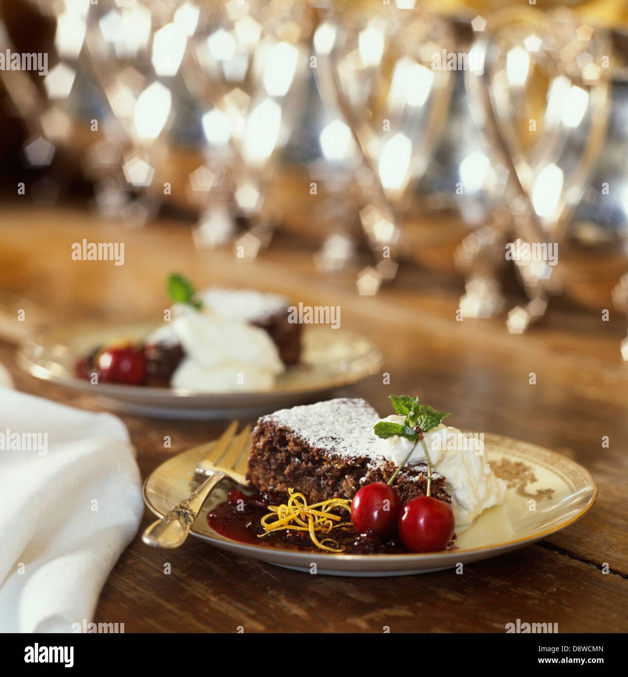 Portion of chocolate cake with cherry puree Stock Photo - Alamy