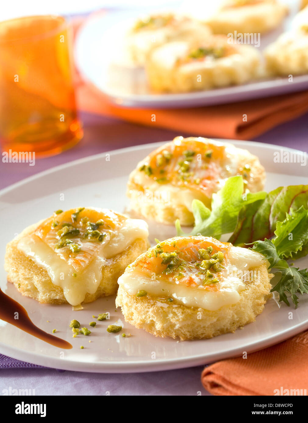 Saint-Albray and pistachio toasted brioche appetizers Stock Photo - Alamy