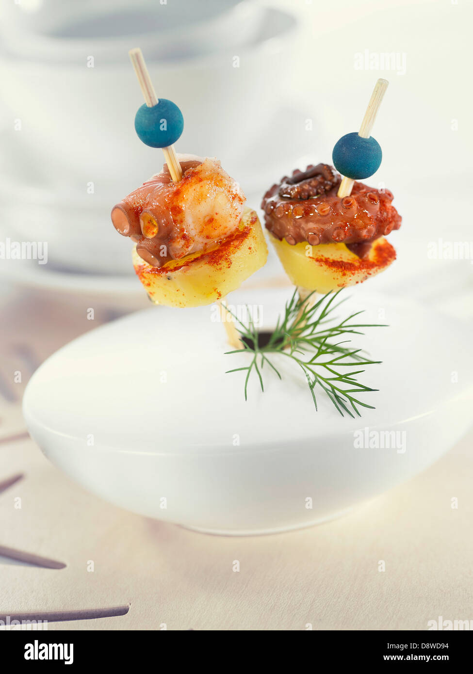 Octopus,potato and mild pepper mini brochettes Stock Photo - Alamy