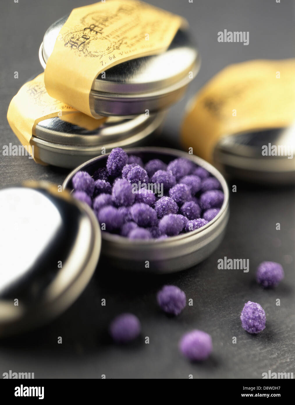Small tins of crystallized violet candies Stock Photo - Alamy