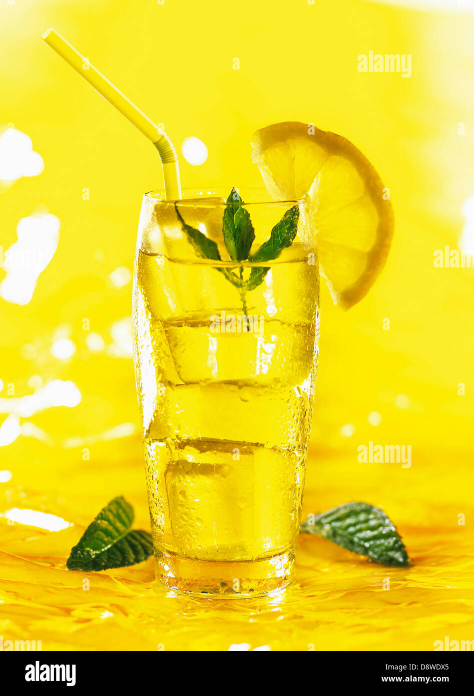 Glass of lemonade with ice cubes Stock Photo - Alamy
