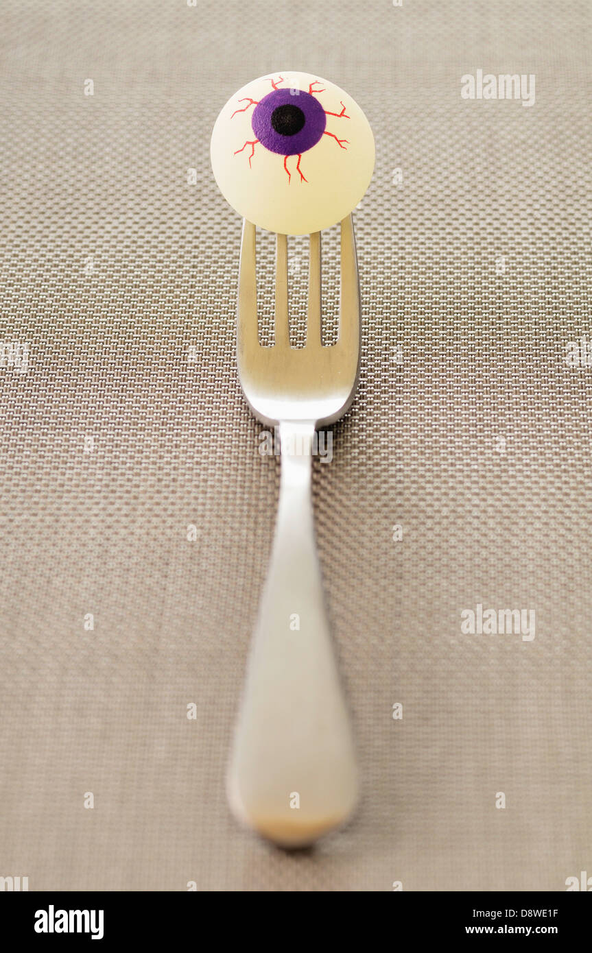 Fake eyeball on a fork Stock Photo - Alamy