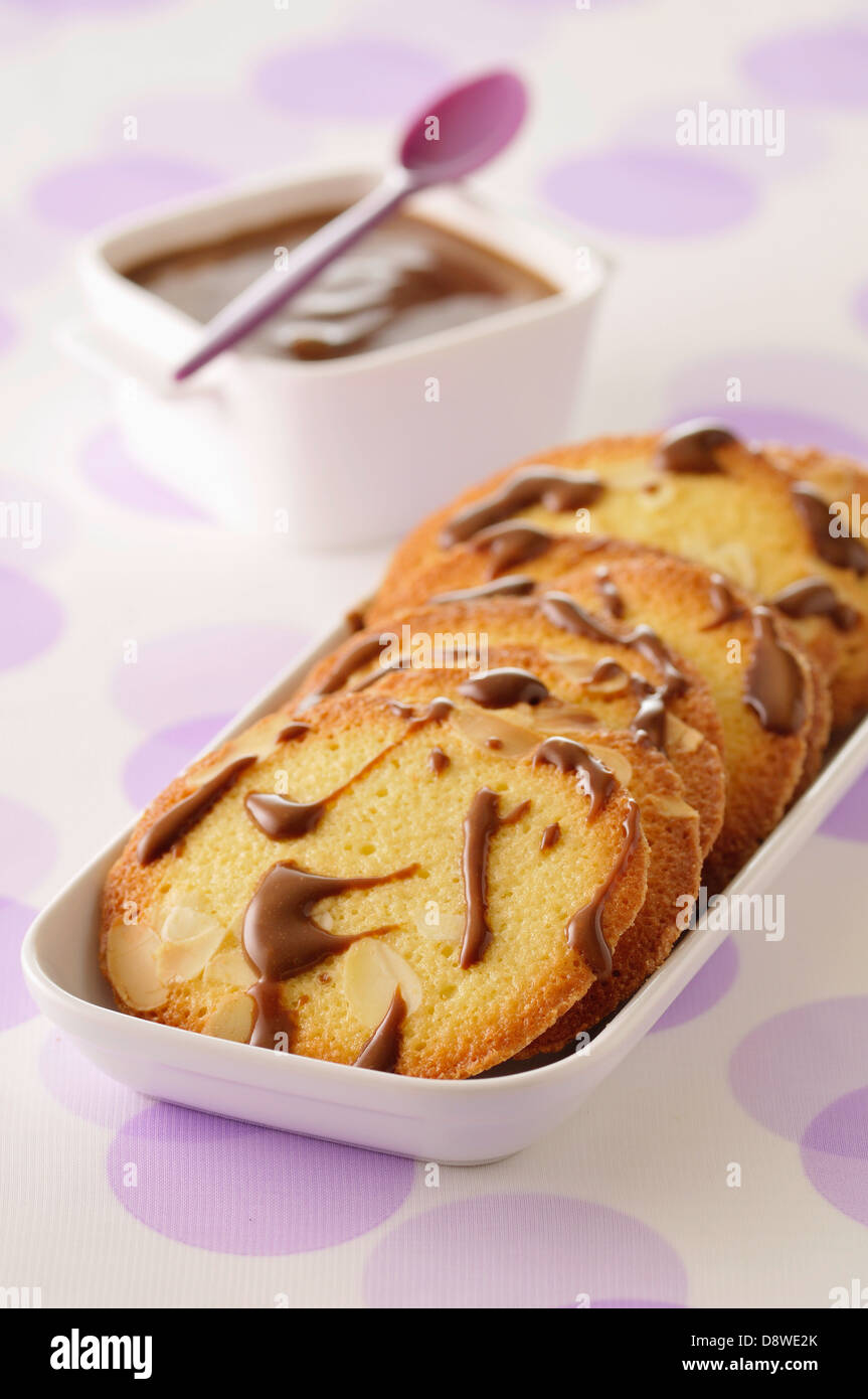 Crisp tuiles with melted Nutella Stock Photo - Alamy