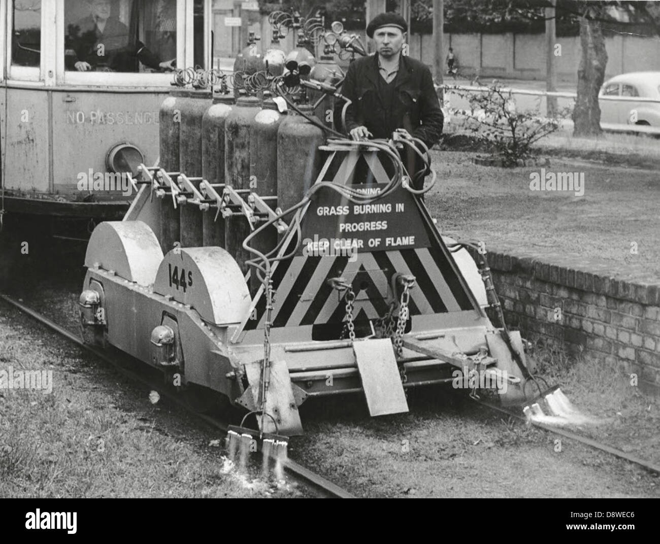Tram track grass burning unit Stock Photo - Alamy
