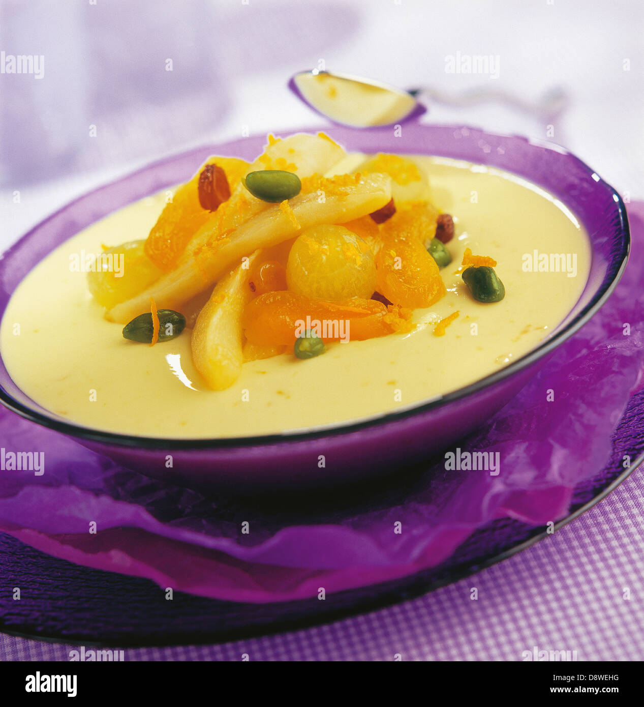 Orange custard cream with stewed and dried fruit Stock Photo - Alamy