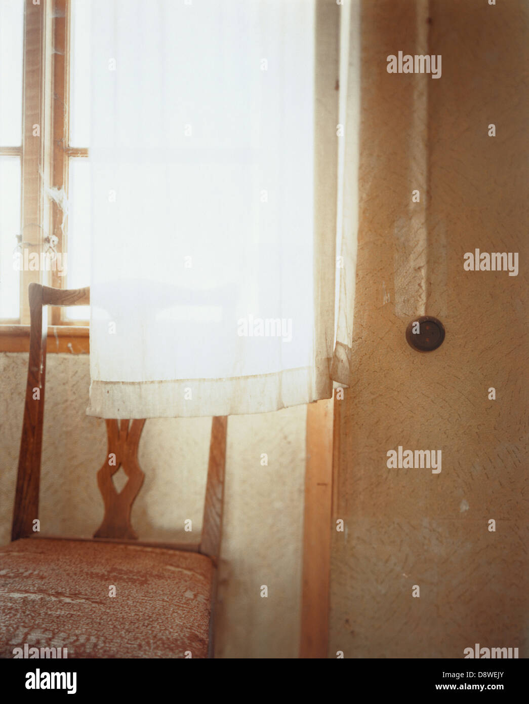 Chair by window Stock Photo - Alamy