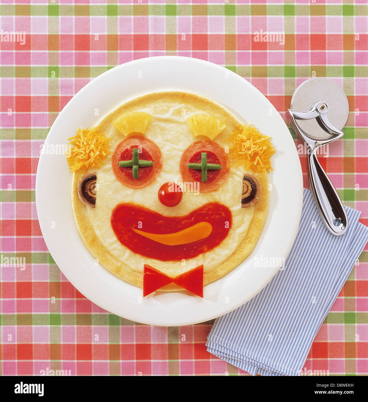 Clown face-shaped pizza Stock Photo - Alamy