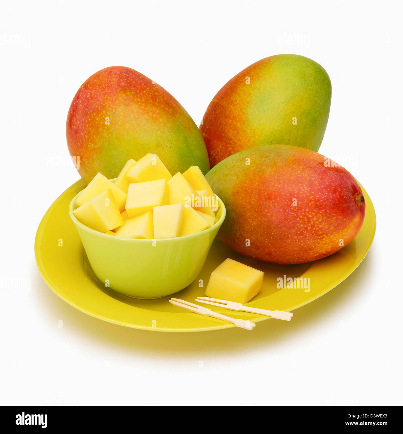 Whole and sliced mangoes Stock Photo - Alamy