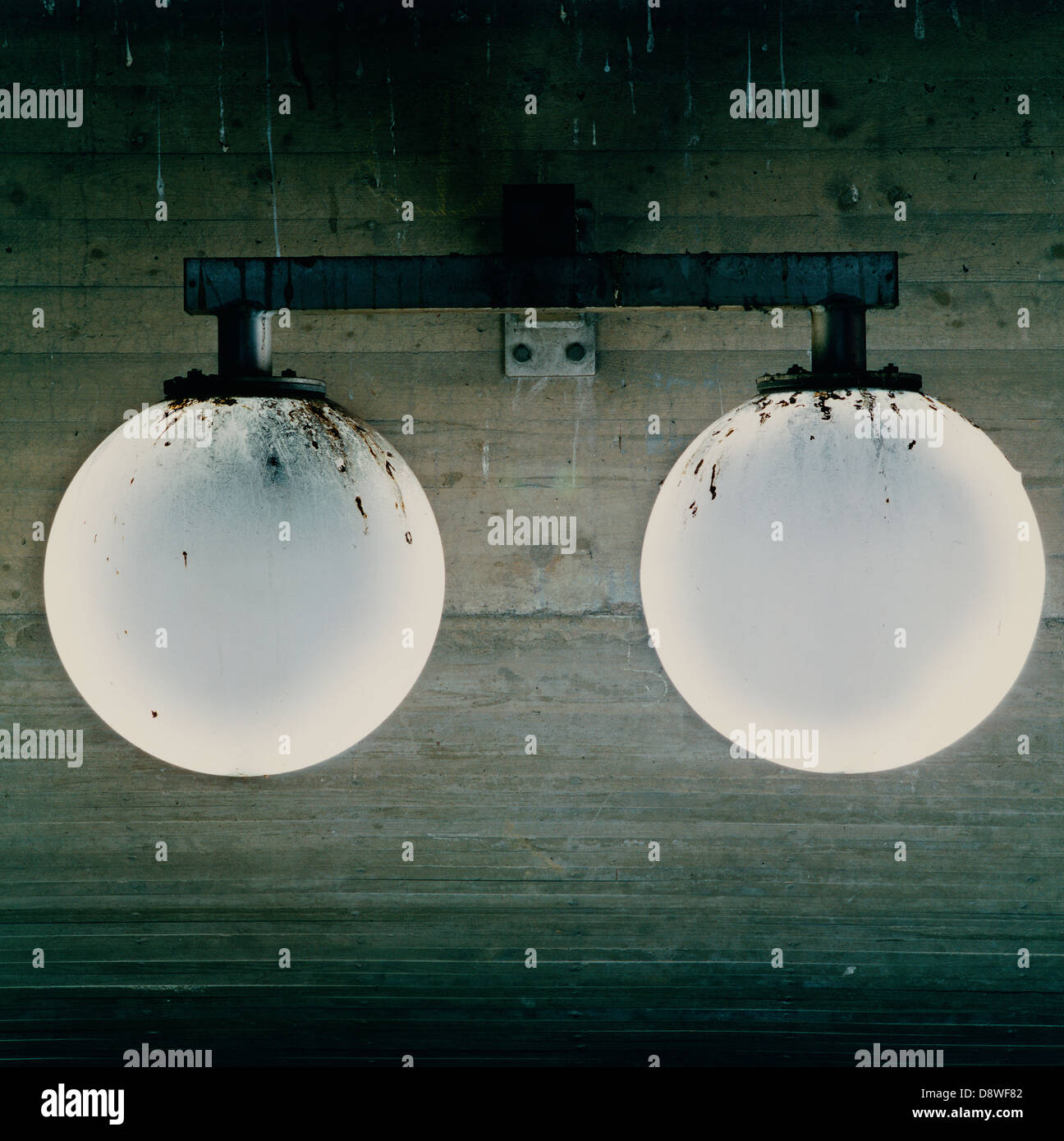 Dirty lamps on a concrete wall Stock Photo - Alamy