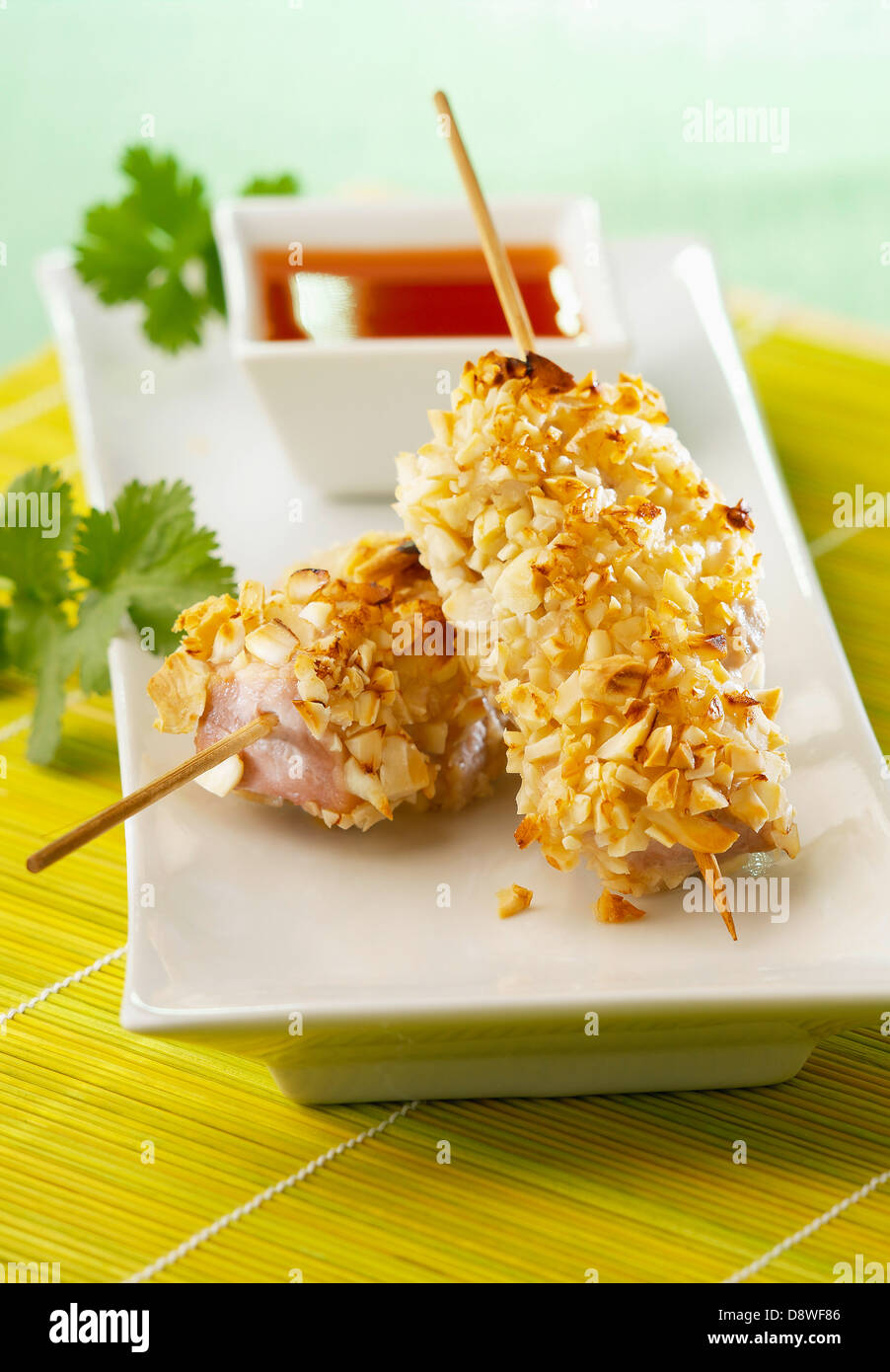 Turkey fillets in hazelnut crust brochettes Stock Photo - Alamy
