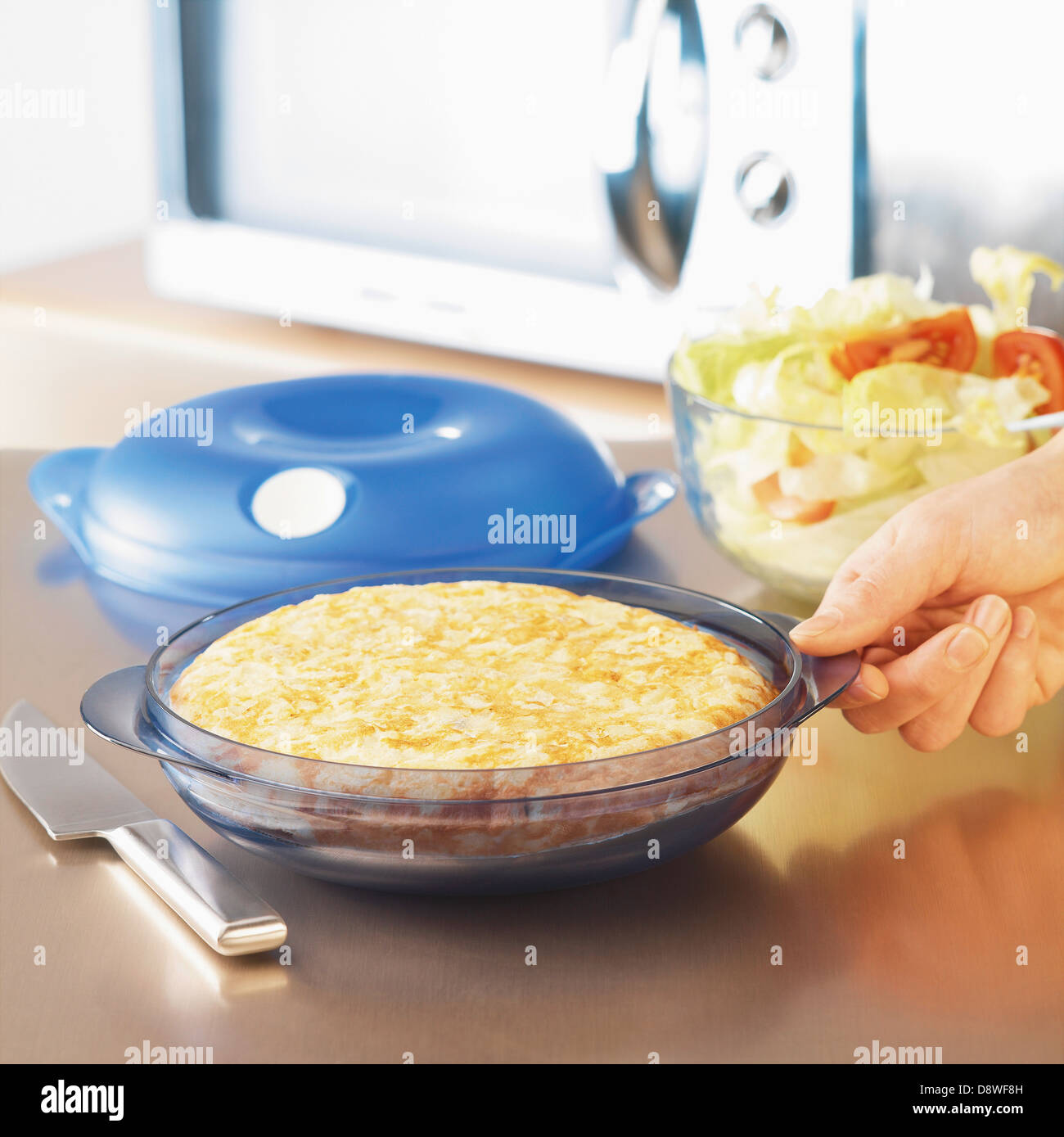Potato tortilla in a Tupperware Stock Photo - Alamy