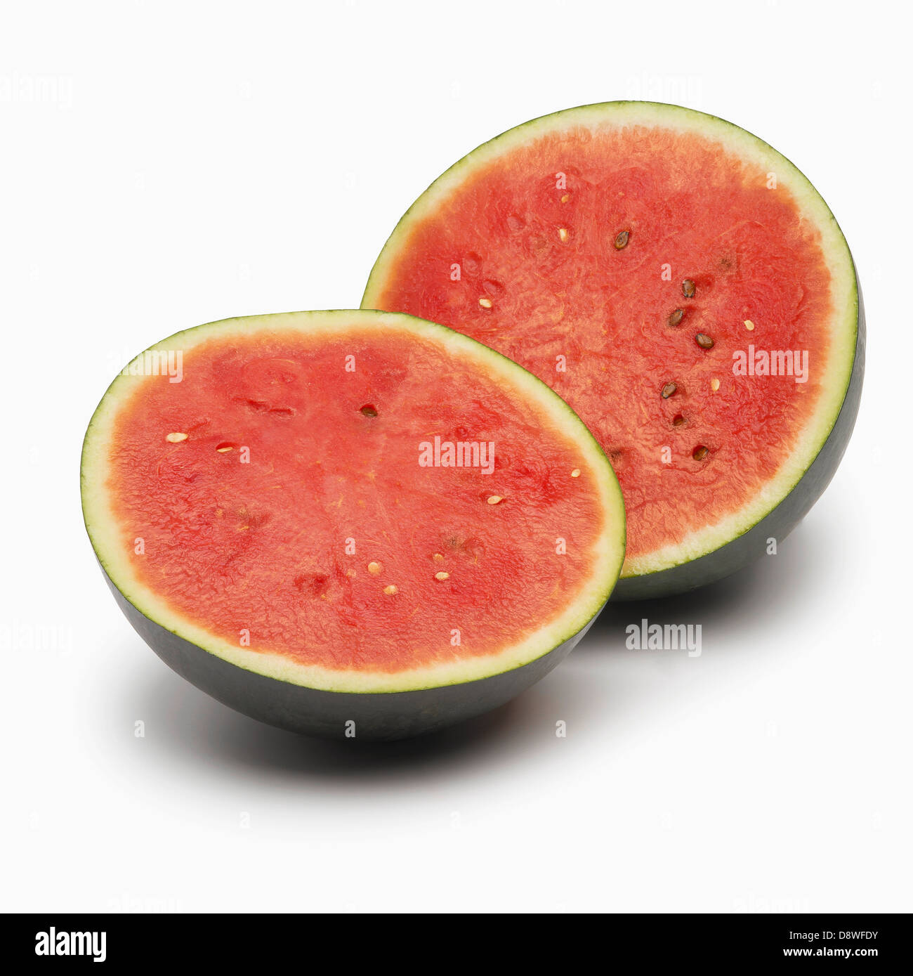 Cut-out whole green watermelon cut in half Stock Photo - Alamy