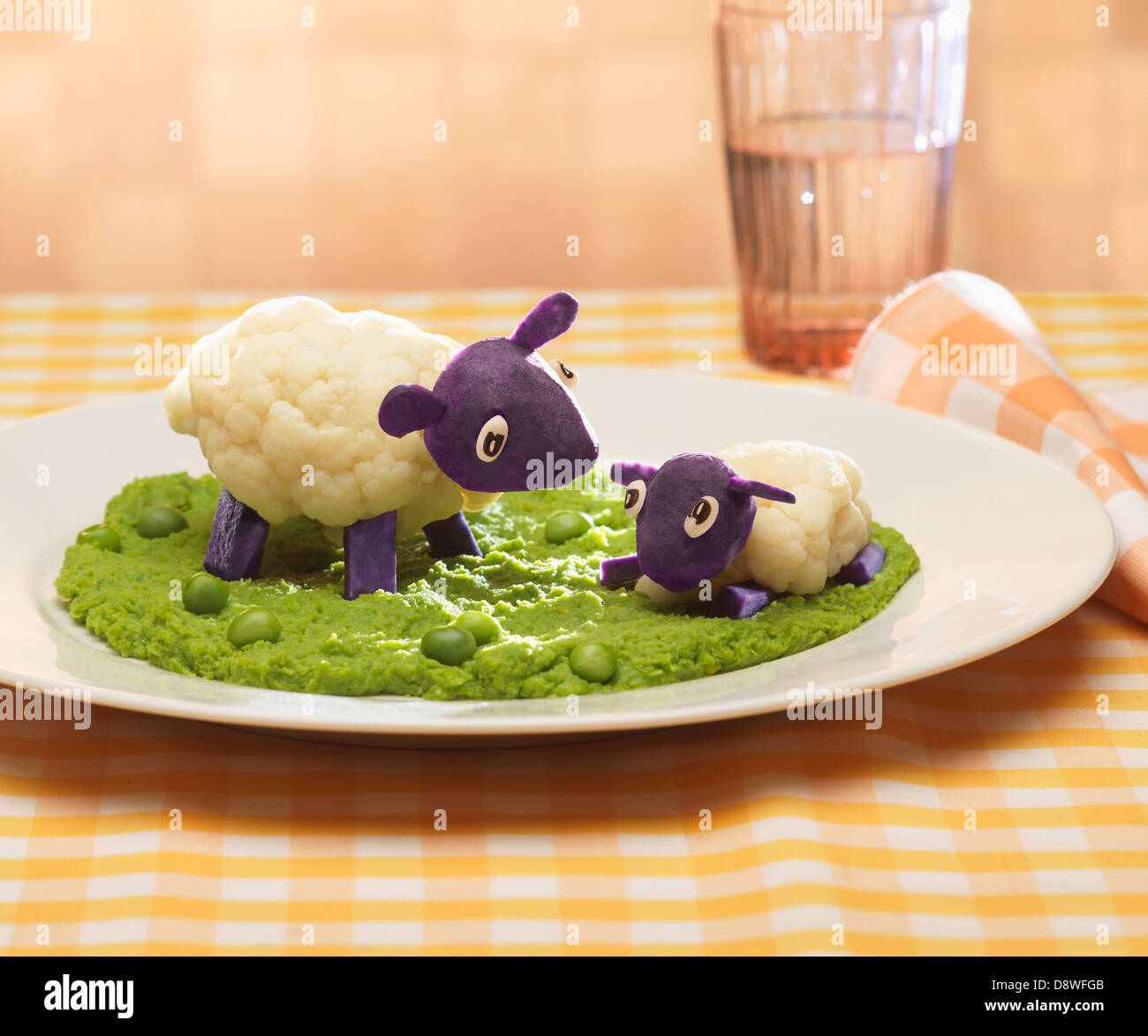 Cauliflower,purple potato and pureed pea dish representing sheep in a ...