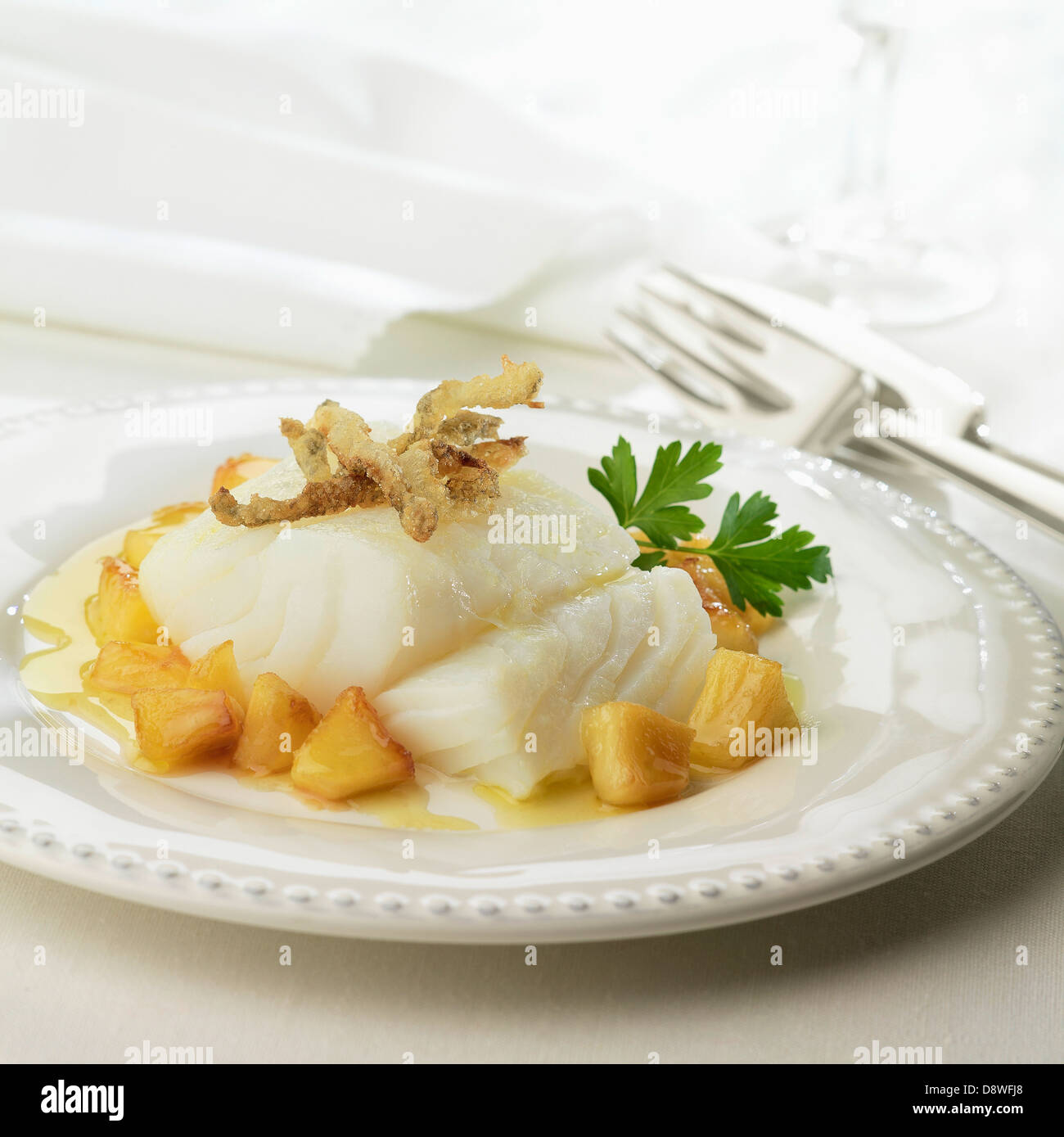 Piece of cod with roast apples and honey sauce Stock Photo - Alamy