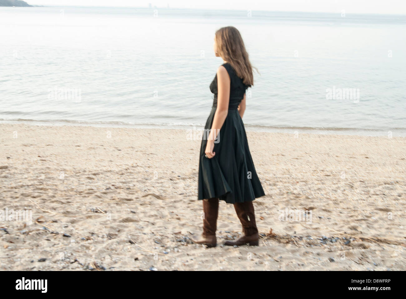 Young woman looking away Stock Photo - Alamy