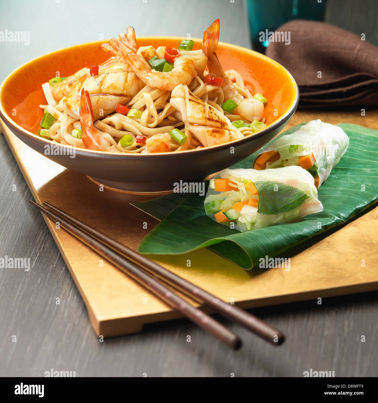 Seafood wok and spring rolls Stock Photo - Alamy