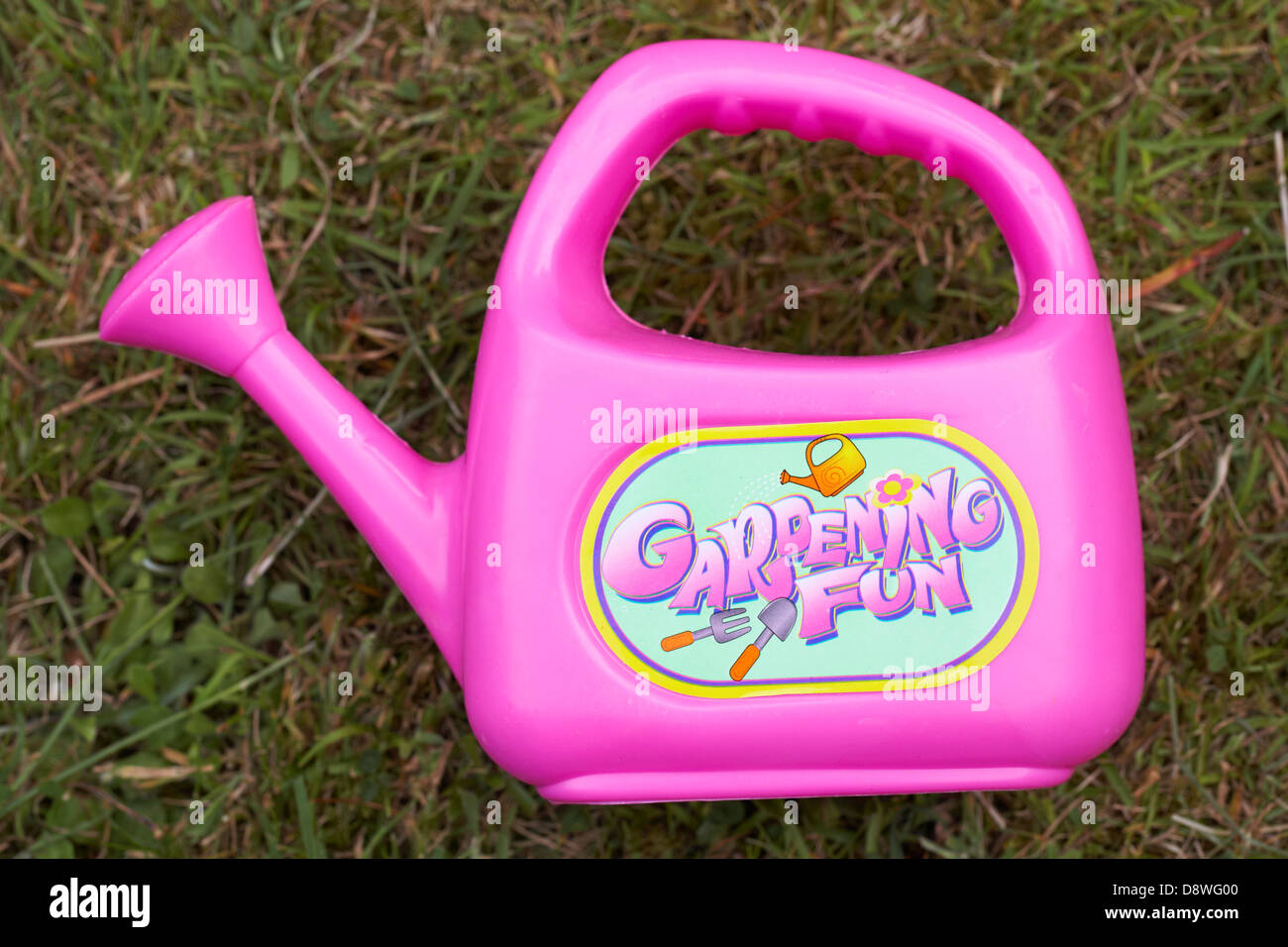 gardening fun watering can Stock Photo - Alamy