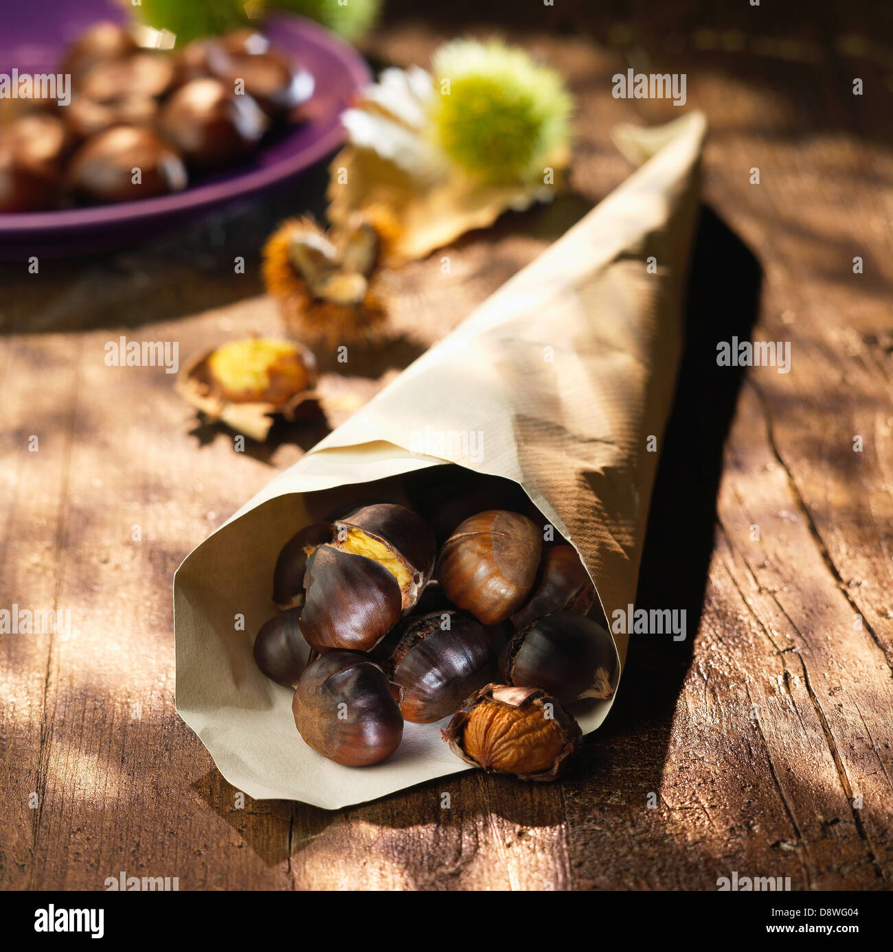 Grilled chestnuts in a paper cone Stock Photo - Alamy