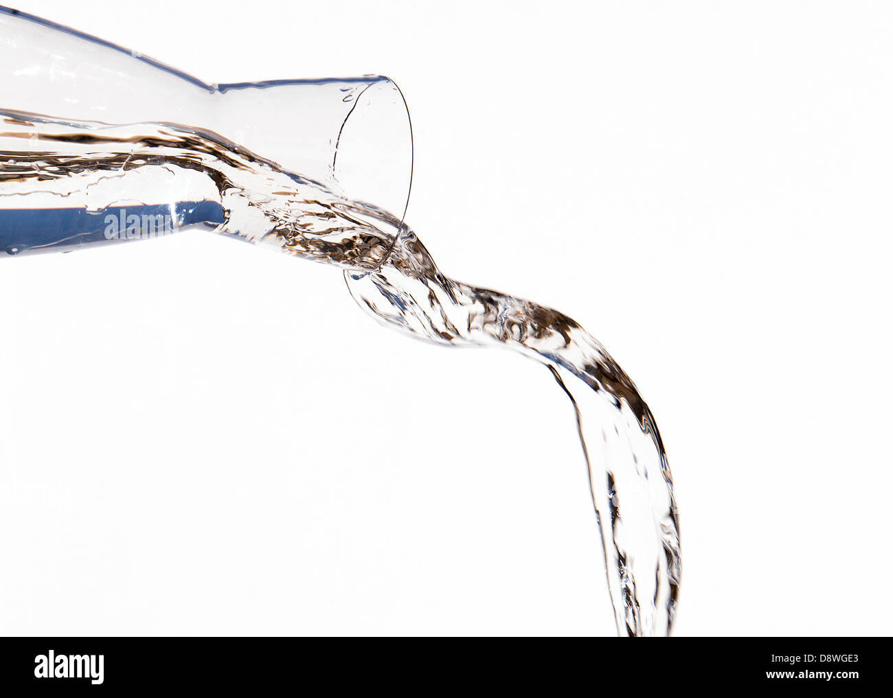 Water is pouring on white background, studio shot Stock Photo - Alamy