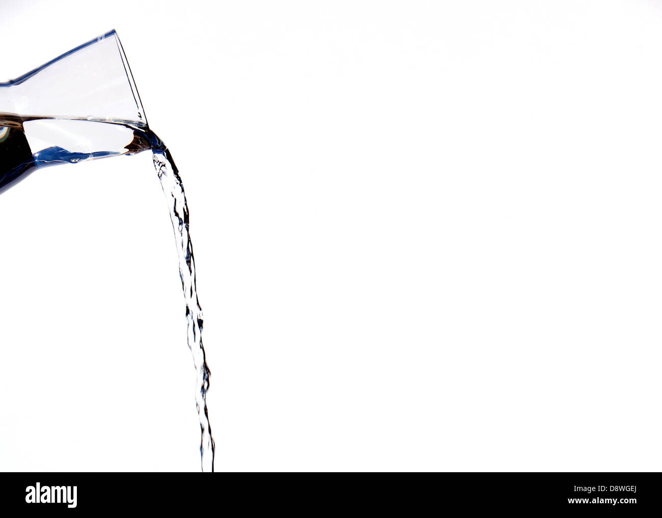 Water is pouring on white background, studio shot Stock Photo - Alamy