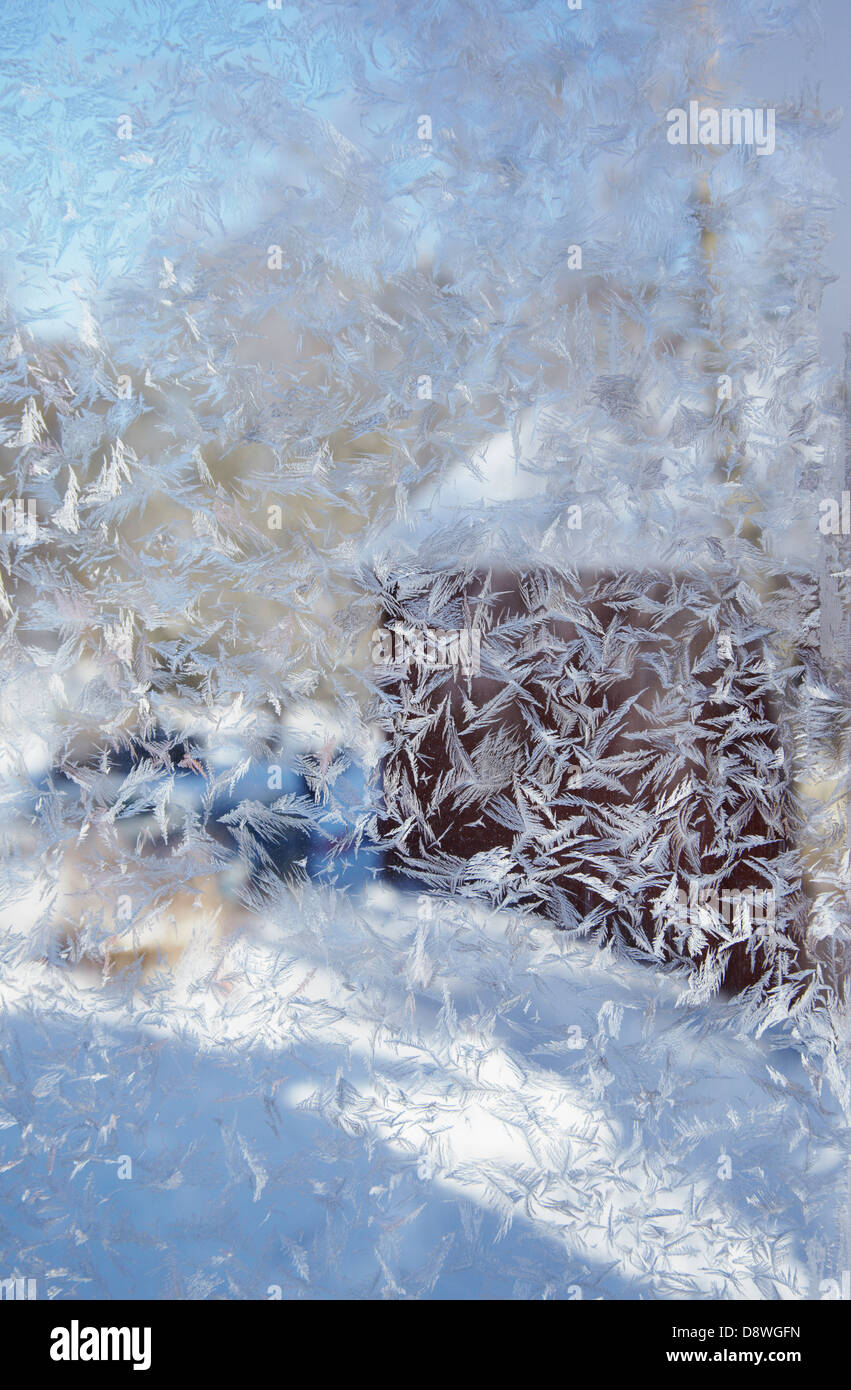 Wooden cottage at winter view through frosted window Stock Photo - Alamy