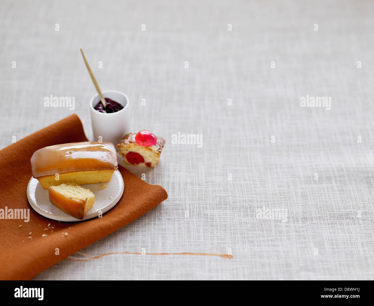 Caramel and candied cherry Financiers Stock Photo - Alamy