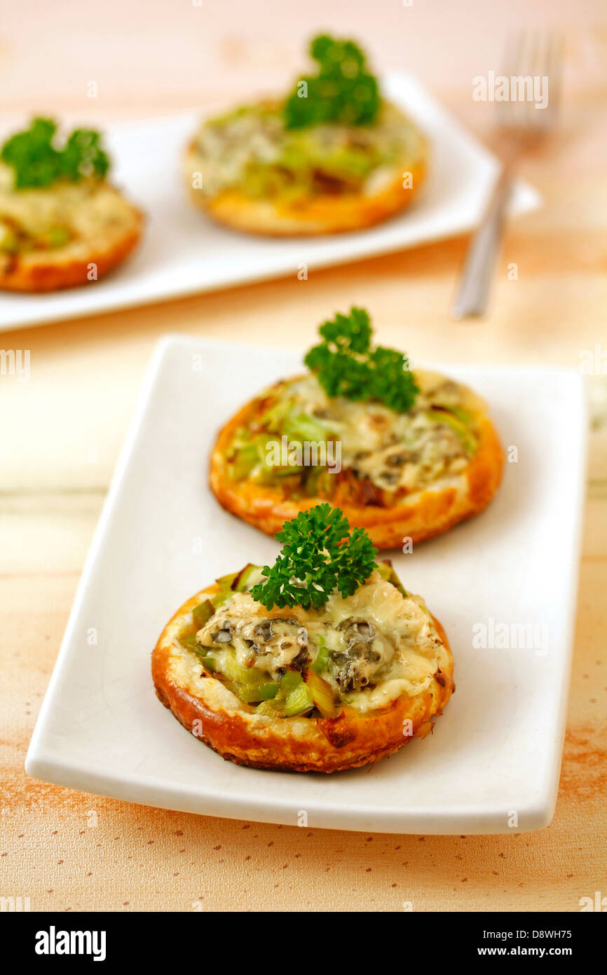 Tartlets with leek and blue cheese. Recipe available Stock Photo - Alamy
