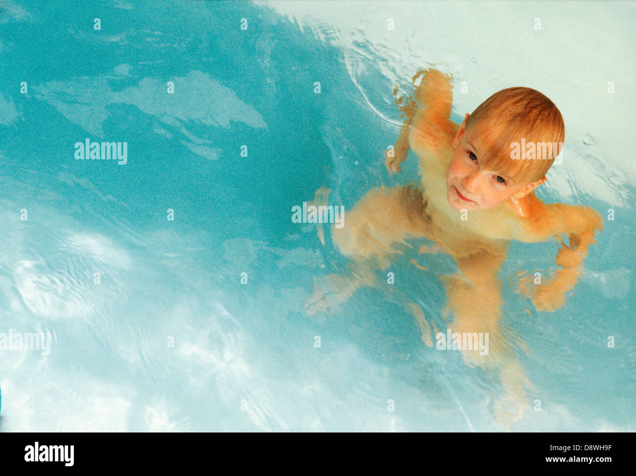 A boy swimming Stock Photo - Alamy