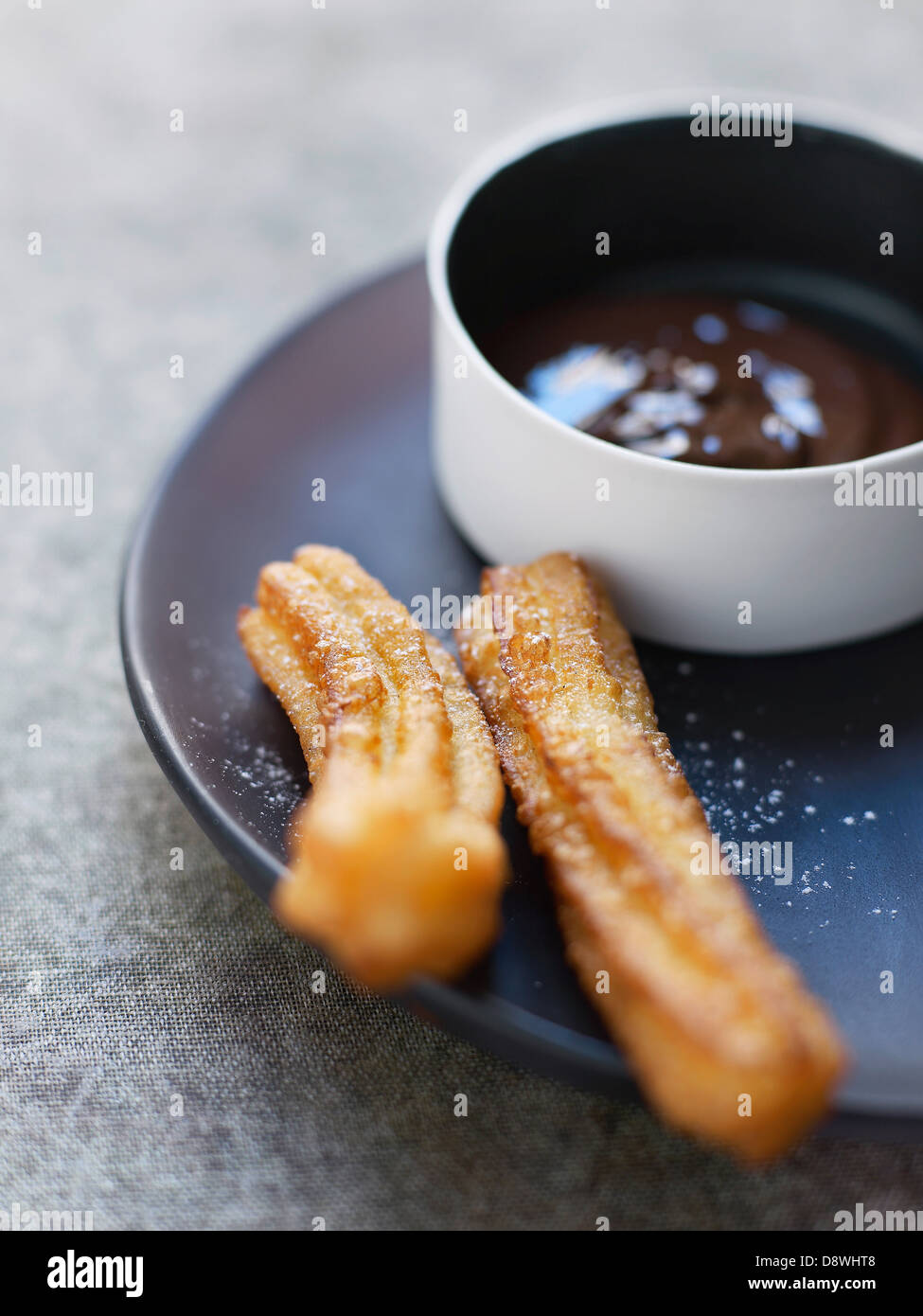 Churros with Nutella sauce Stock Photo - Alamy