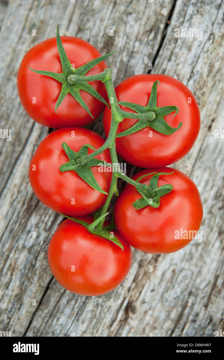 Bunch of tomatoes outdoors Stock Photo - Alamy