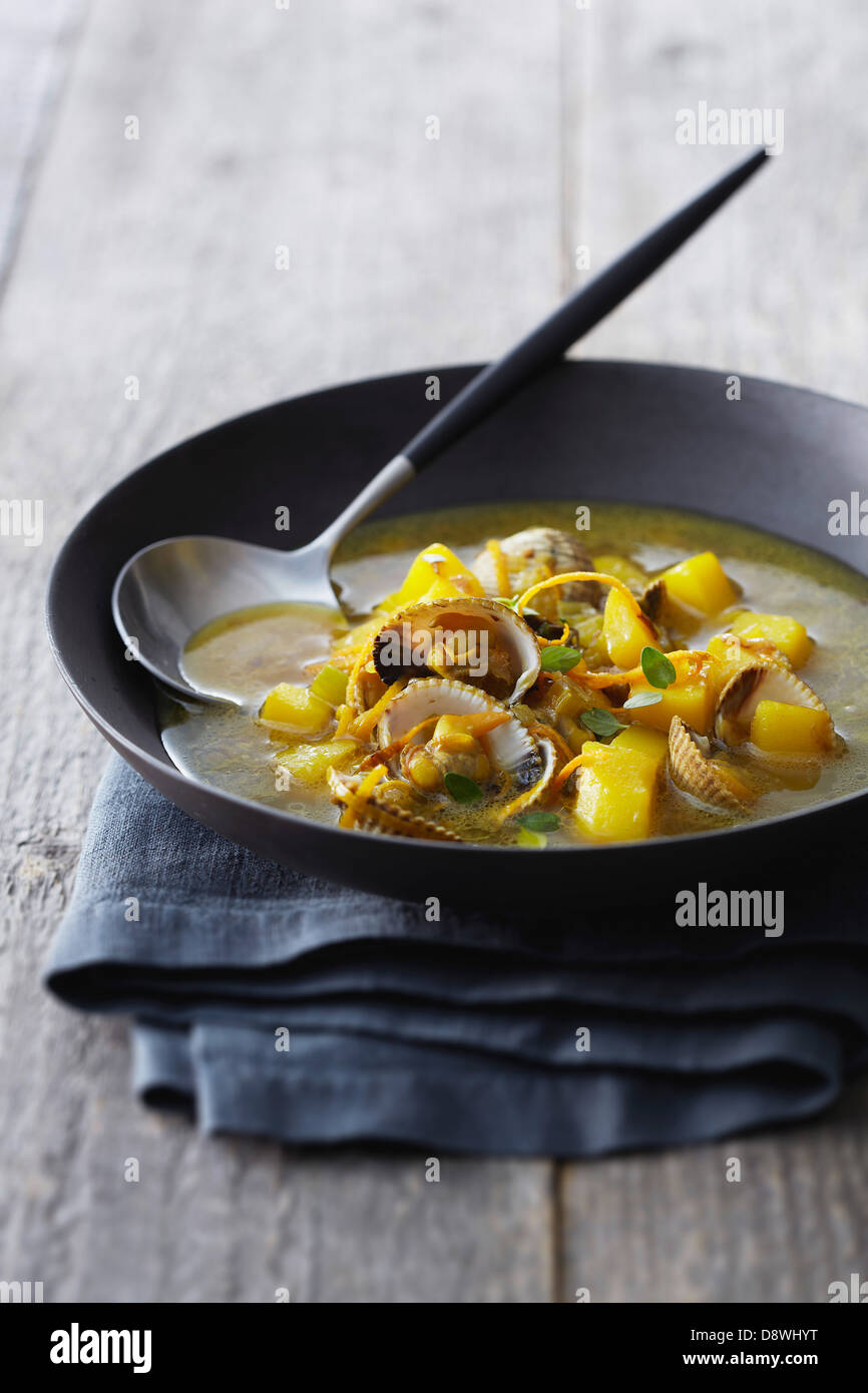 Cockle and orange soup Stock Photo - Alamy