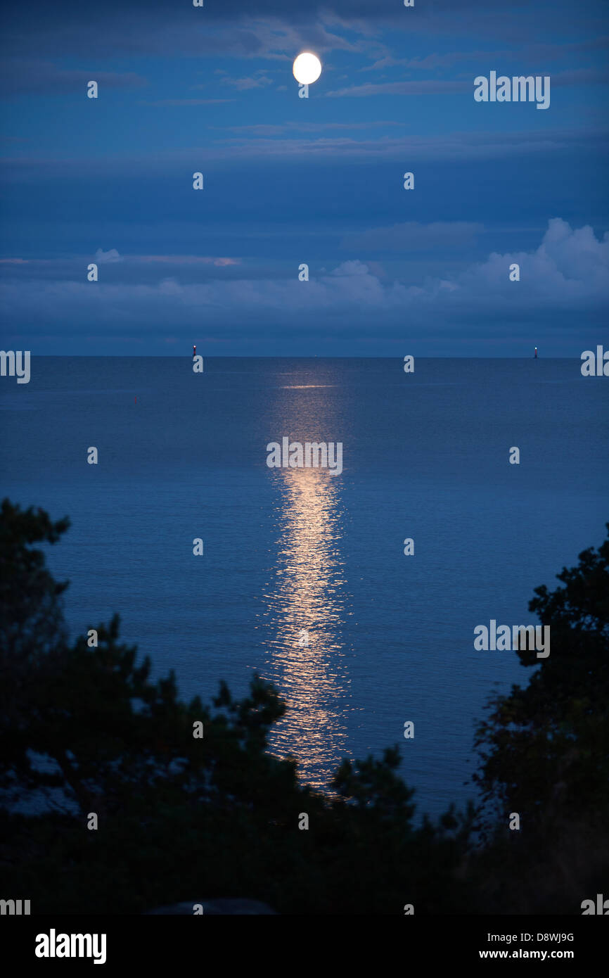 Full moon over sea Stock Photo - Alamy