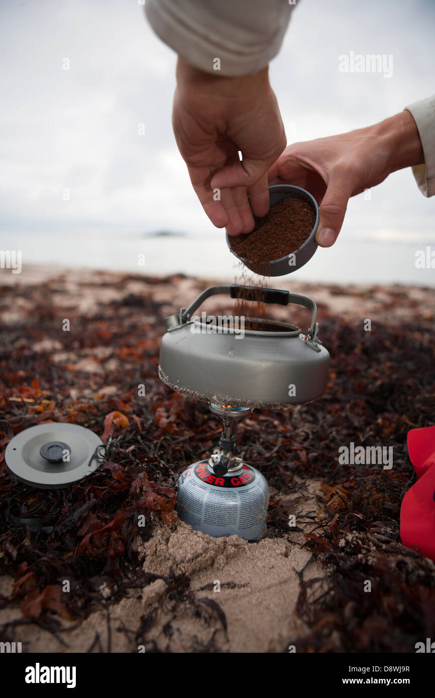 Man preparing coffee in pot Stock Photo - Alamy