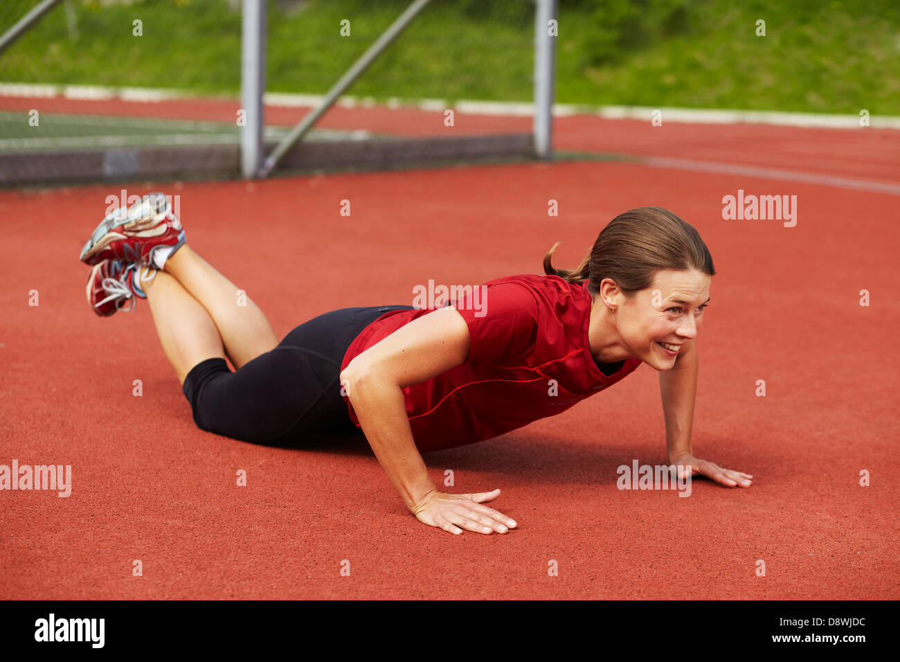 Female athlete doing push-ups Stock Photo - Alamy