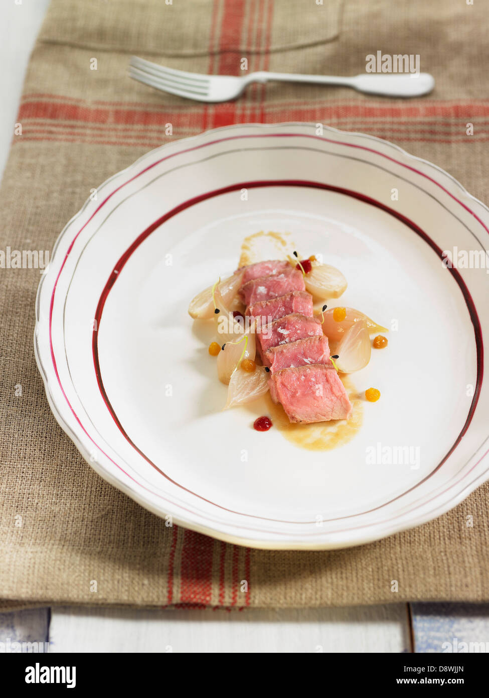 Lamb entrecôte with shallots Stock Photo - Alamy