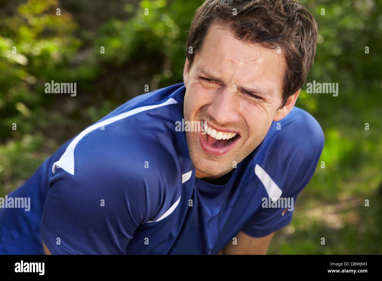 Tired male athlete Stock Photo - Alamy