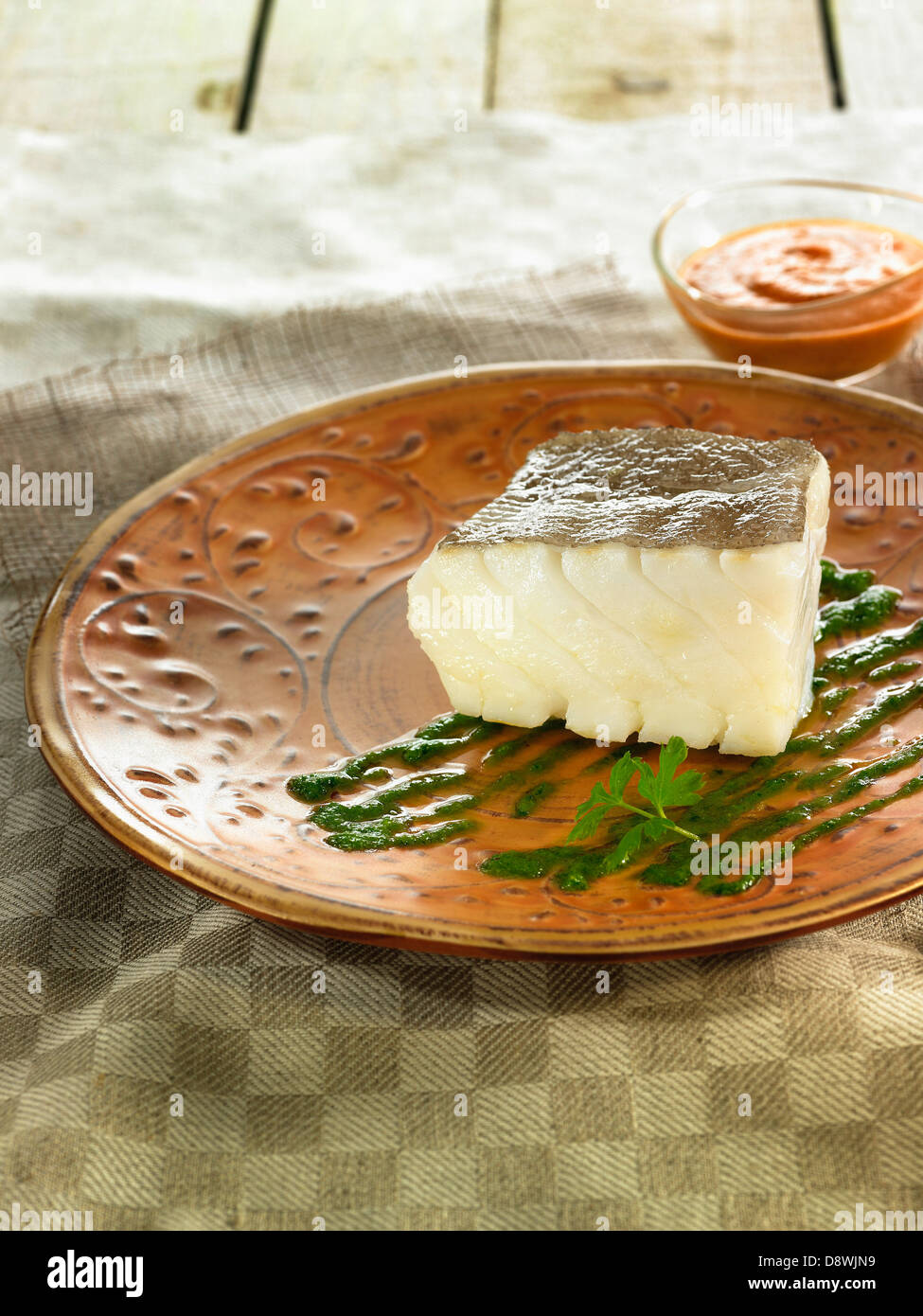 Salt-cod with parsley puree and Romesco sauce Stock Photo - Alamy