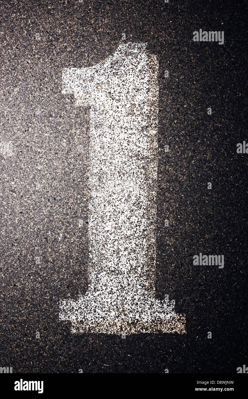 Number 1 painted on asphalt Stock Photo - Alamy