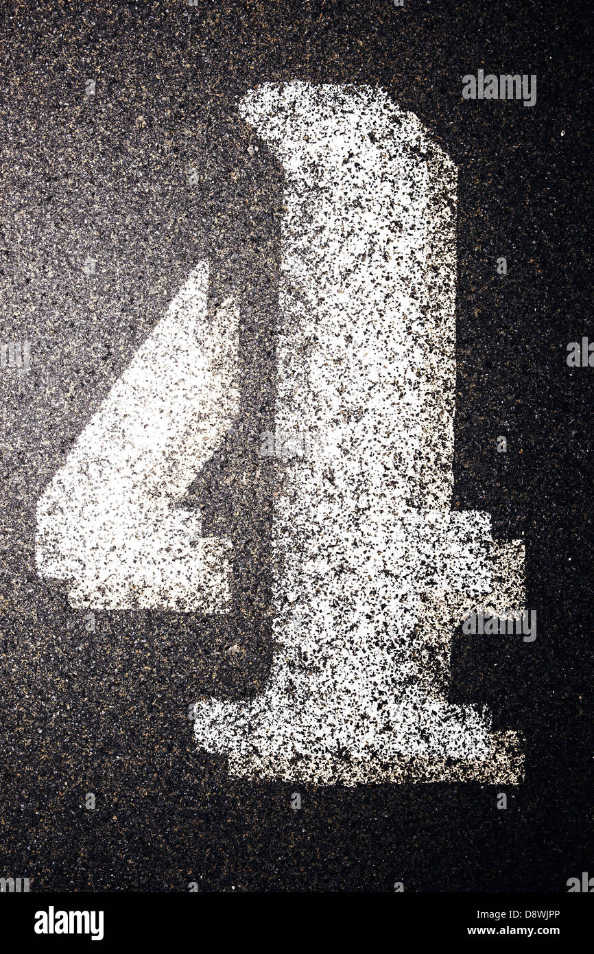 Number 4 painted on asphalt Stock Photo - Alamy