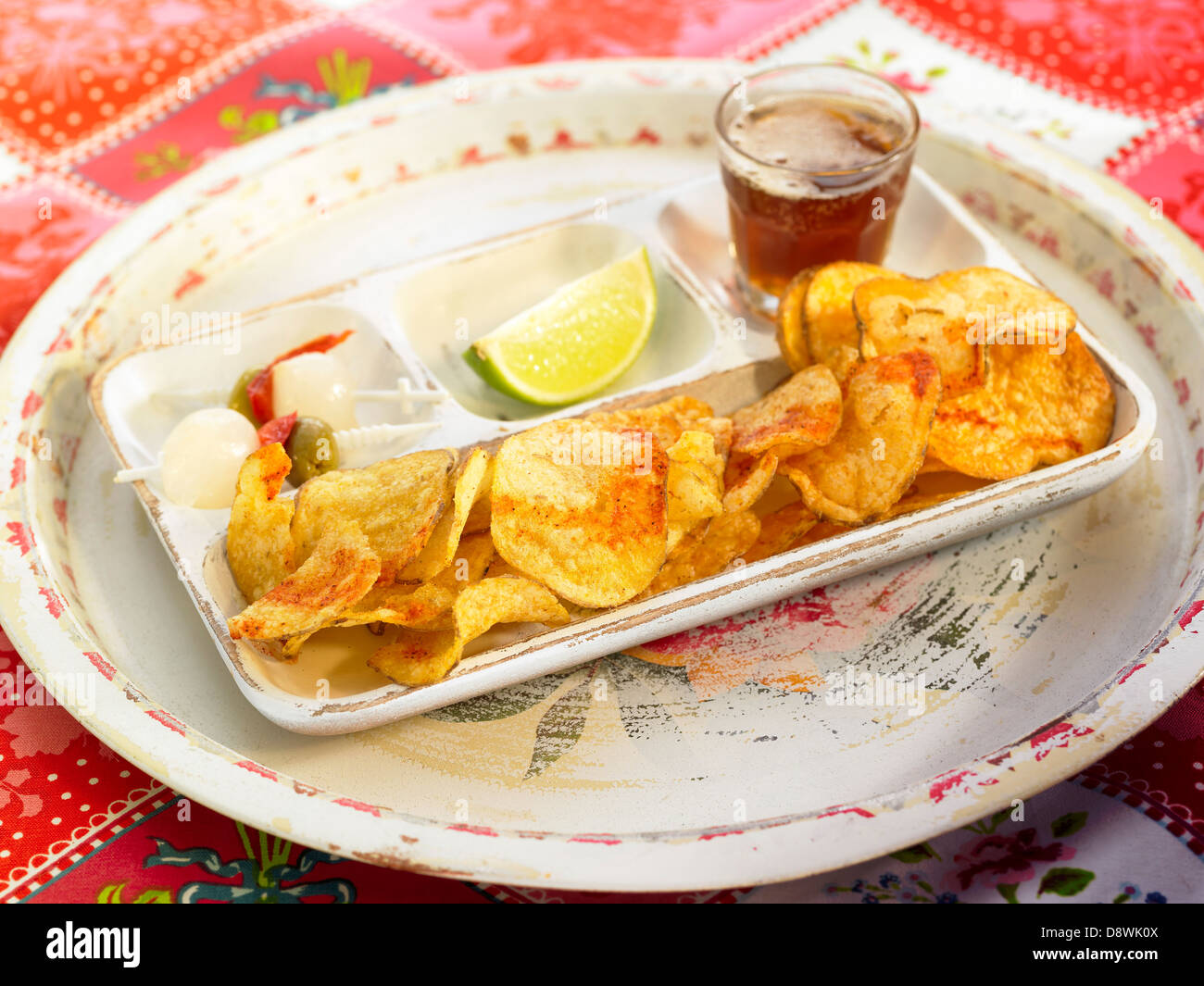 Aperitif tray with saffron-flavored crisps Stock Photo - Alamy