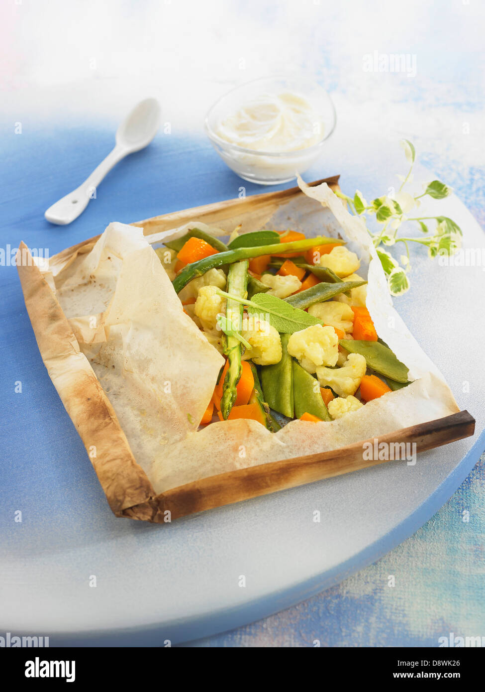 Vegetables cooked in wax paper Stock Photo - Alamy